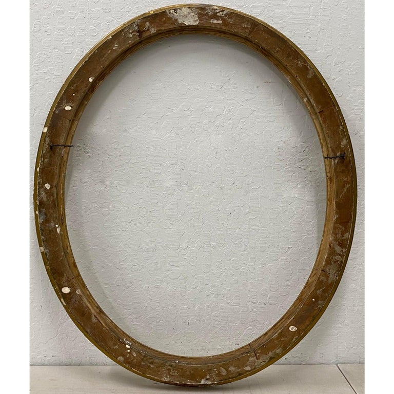 large gold oval frame
