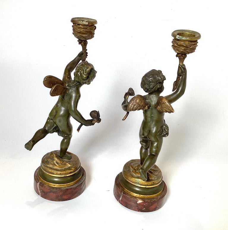 Early 20th Century Pair Of Bronze Cherub Candlesticks For Sale at 1stDibs