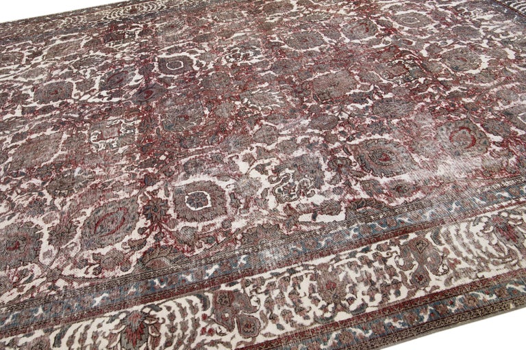 Vintage Handmade Distressed Persian Wool Rug In Red For Sale at 1stDibs