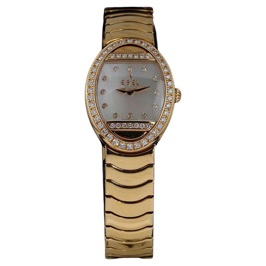 Ladies Tourneau Gold Watch With Diamonds Sapphires And Mother Of Pearl