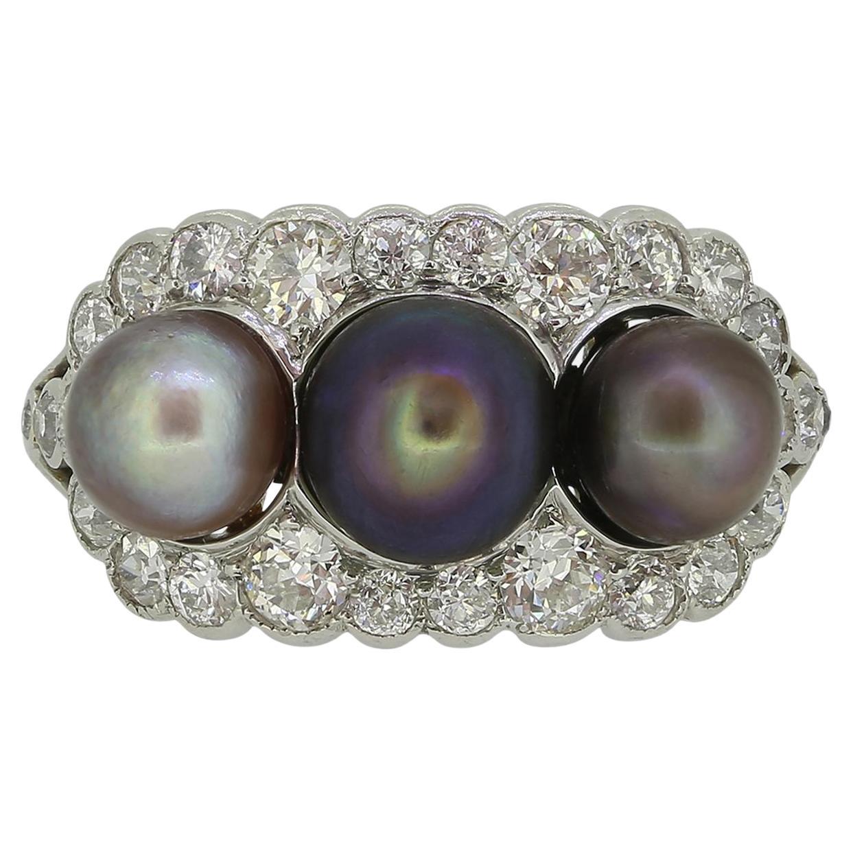 An Edwardian natural pearl and diamond crossover ring For Sale at 1stDibs
