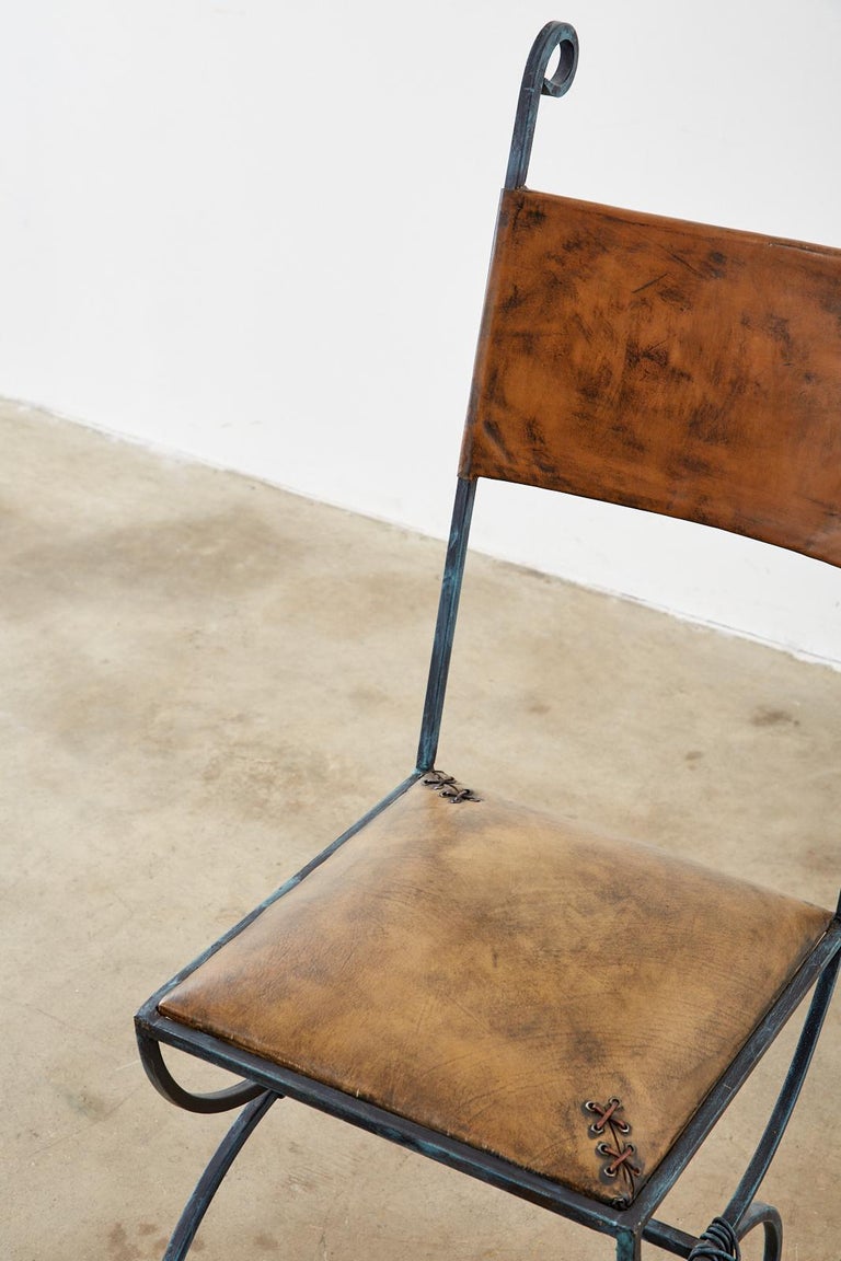 Eight Ilana Goor Style Curule Leg Iron Leather Dining Chairs at 1stDibs