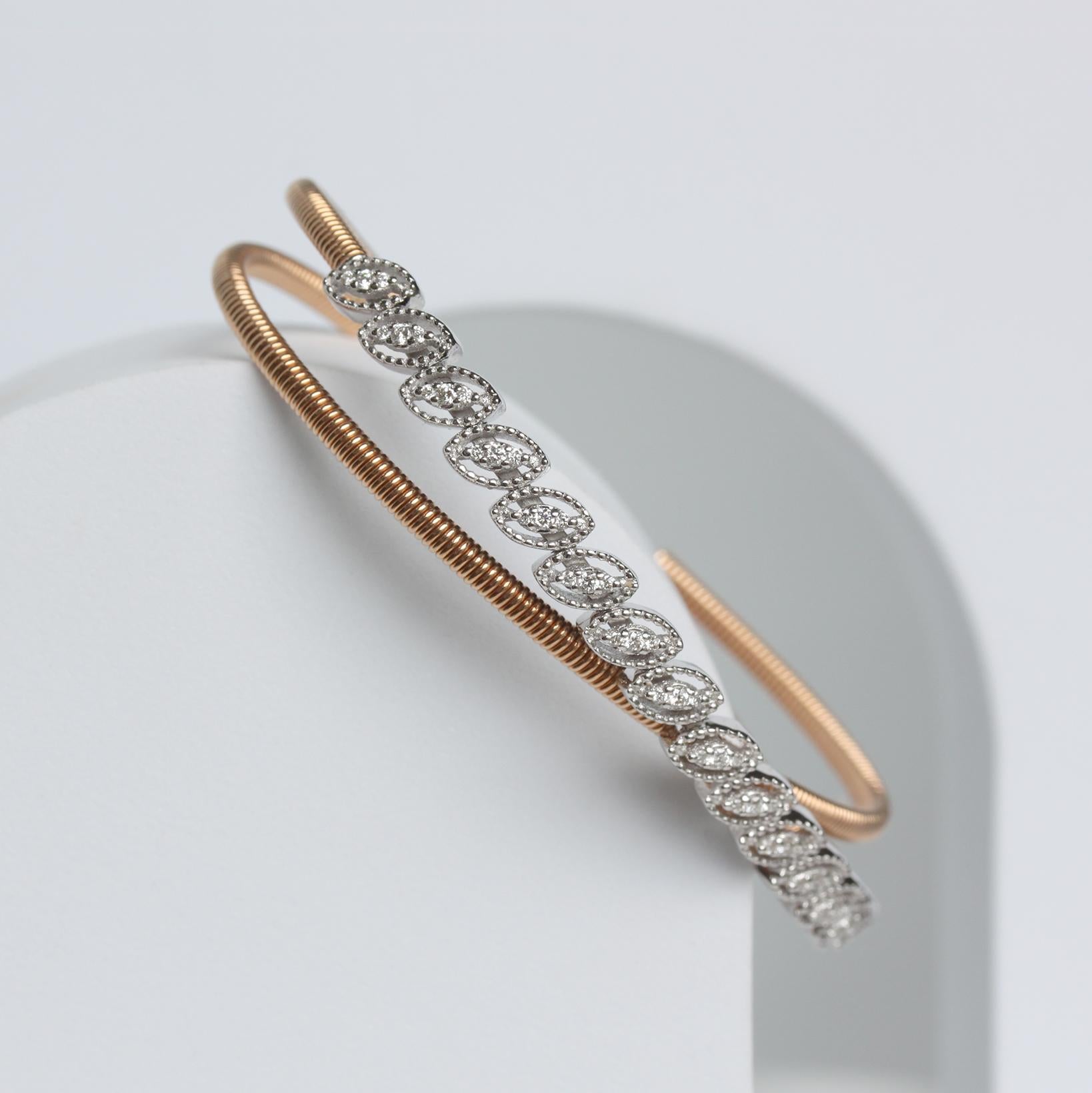 Elegant 18K Gold Spring Bangle Adorned with Natural Diamonds For Sale at 1stDibs