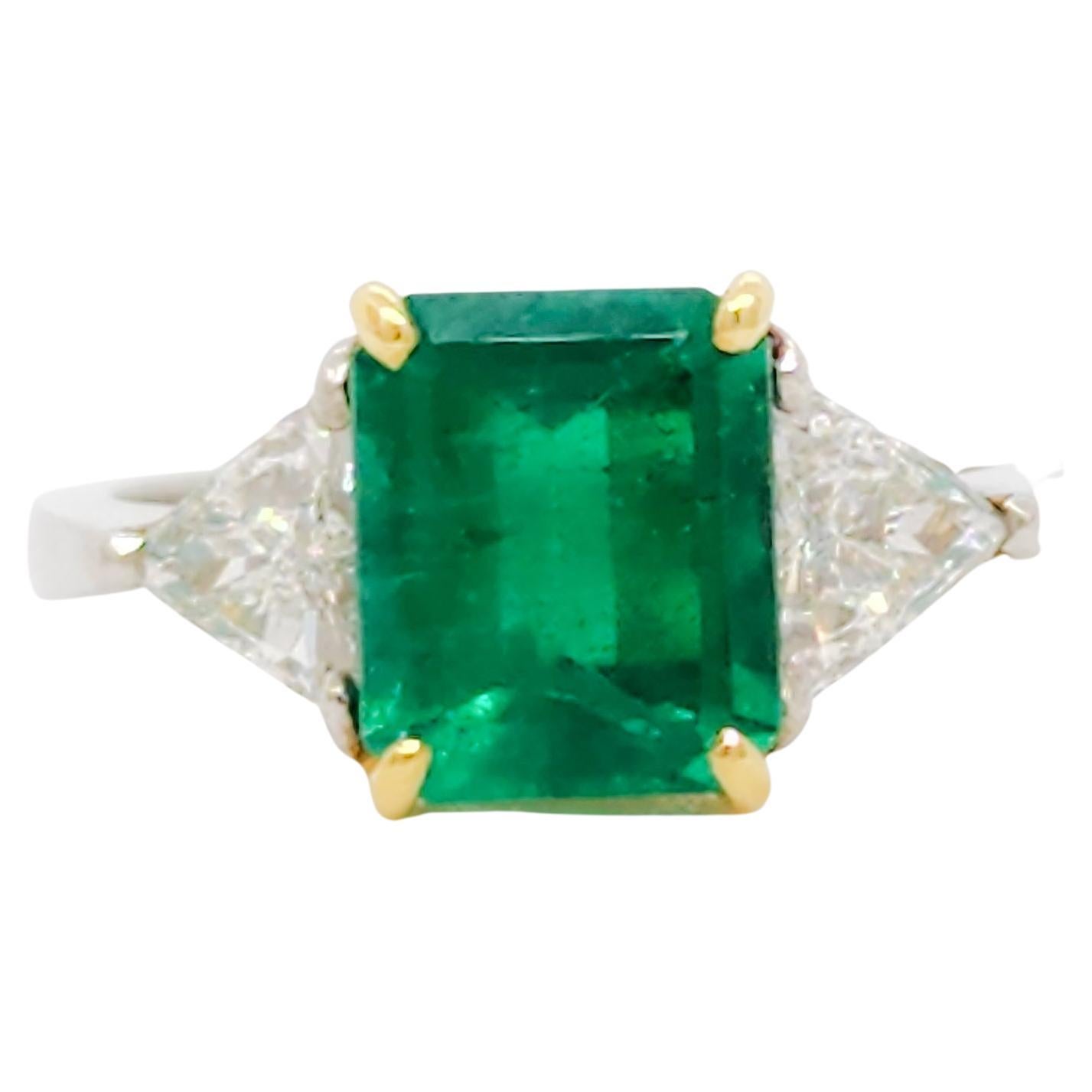 Three-Stone Platinum/ 18 Karat Yellow Gold Emerald Cut Emerald and ...