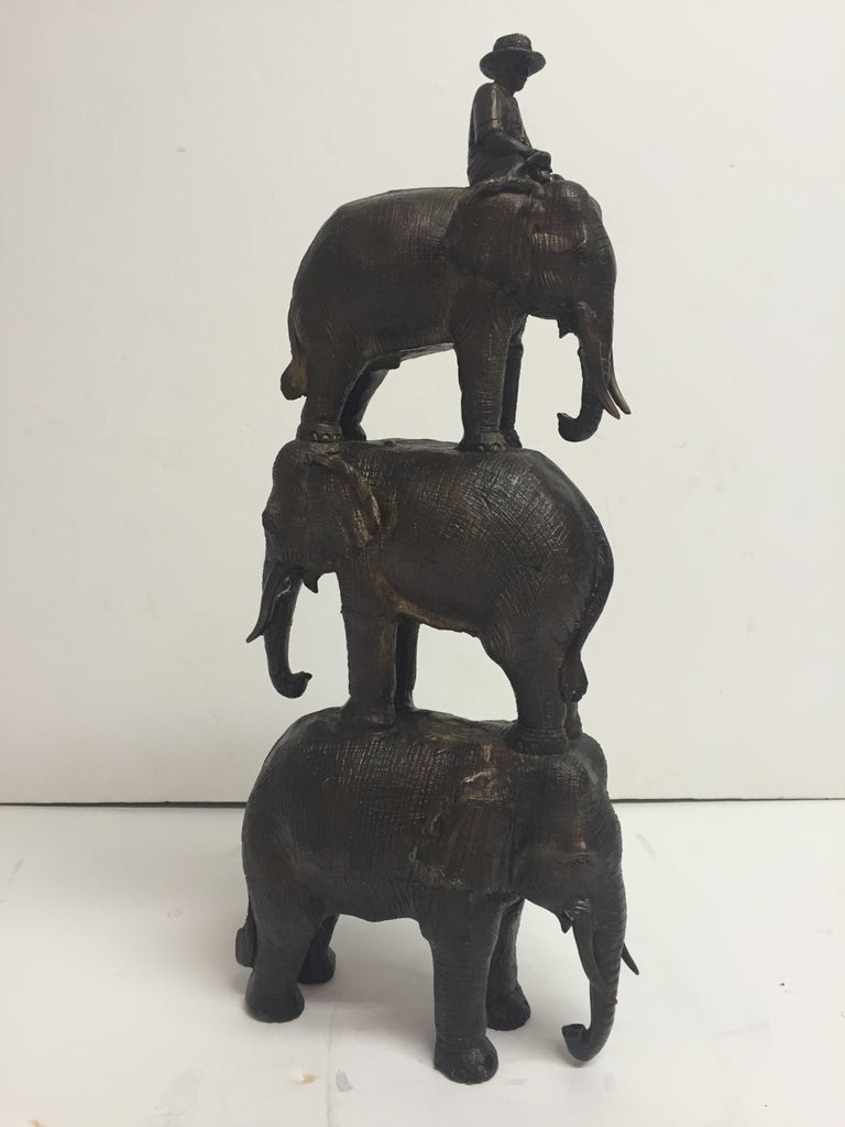 Enchanting Bronze Sculpture of a Man Riding Three Elephants For Sale at ...