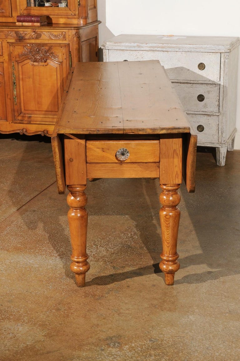 English 1875s Pine Drop Leaf Table with Two Lateral Drawers and Turned Legs For Sale at 1stDibs