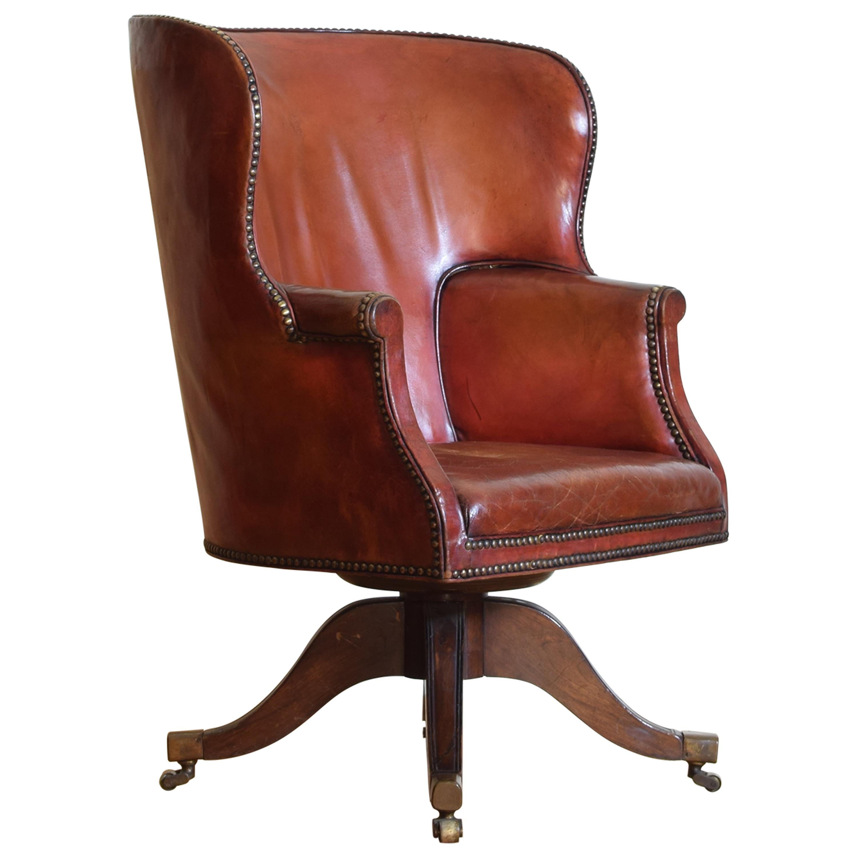 English Mahogany and Leather Upholstered Swivel Wing Chair at 1stDibs