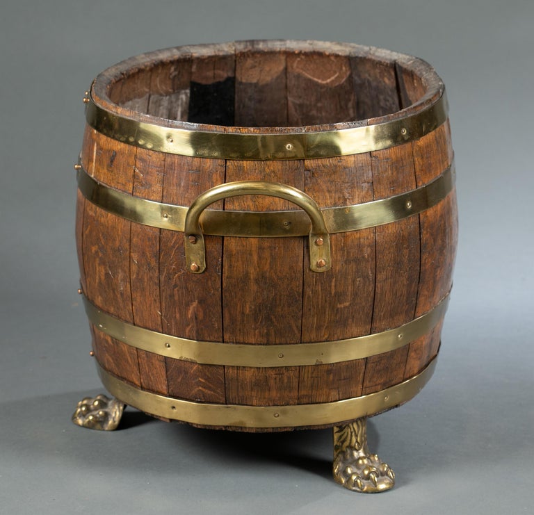 English Oak and Brass Barrel Shaped Cellarette with Paw Feet at 1stDibs