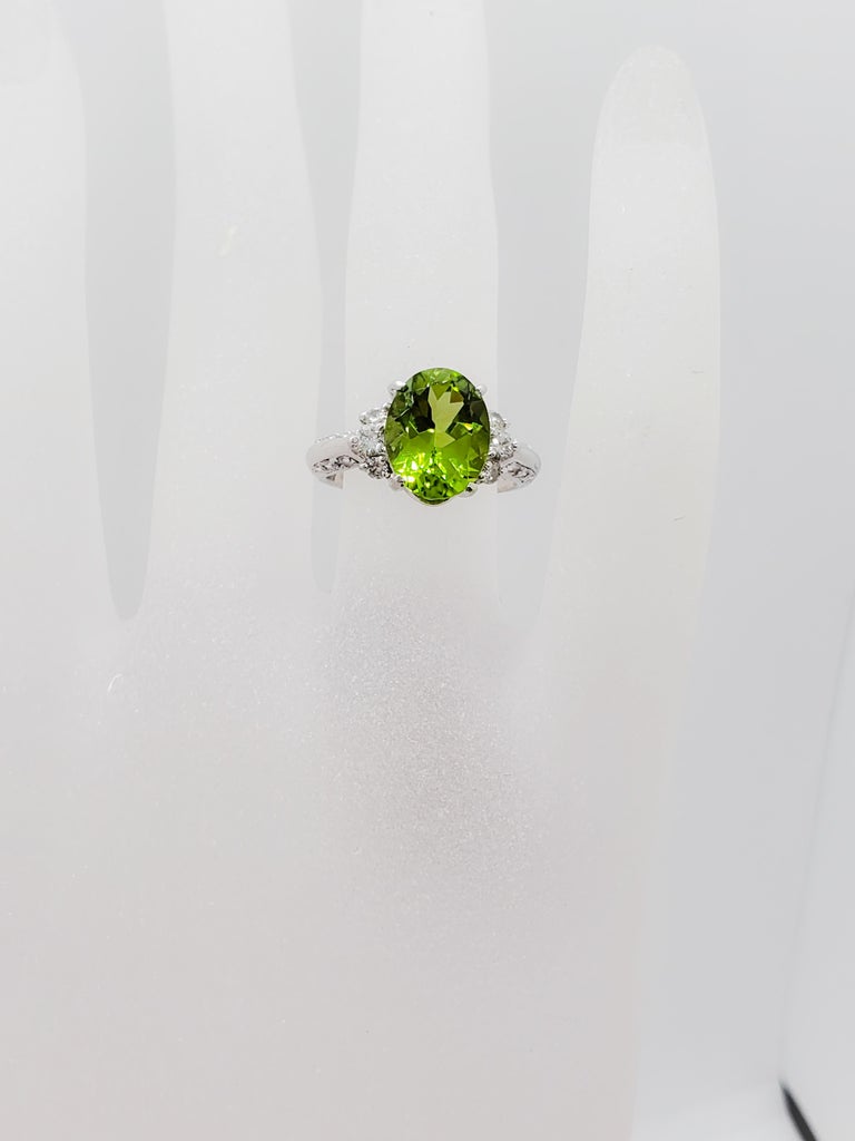 Estate Peridot Oval and White Diamond Ring in Platinum For Sale at 1stDibs