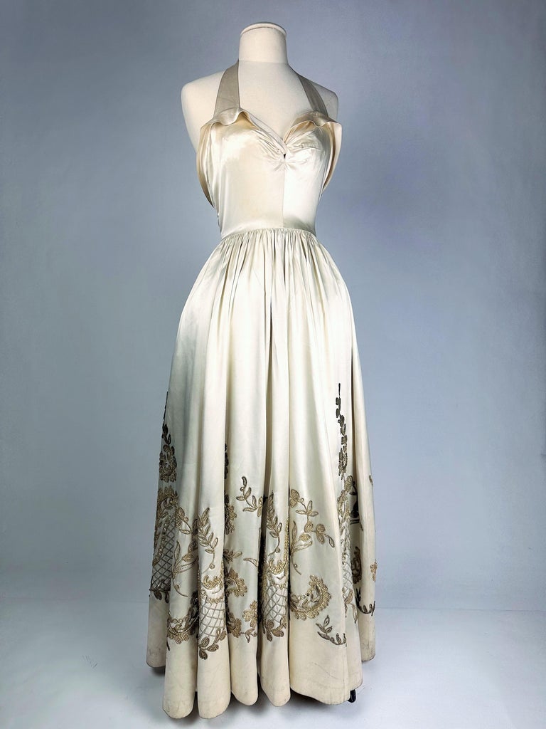 Evening dress by Lucien Lelong Couture in embroidered champagne satin ...