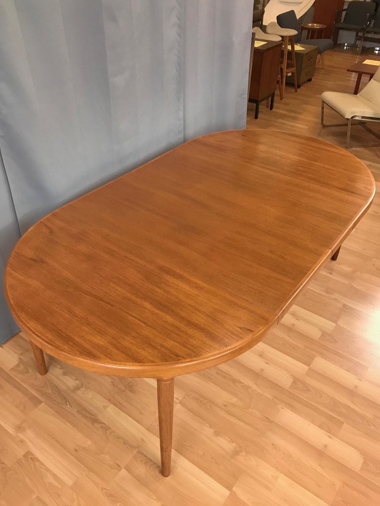 Expansive Danish Modern Extendable Teak Dining Table at 1stDibs