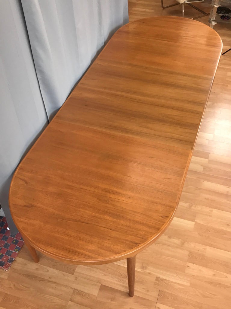 Expansive Danish Modern Extendable Teak Dining Table at 1stDibs