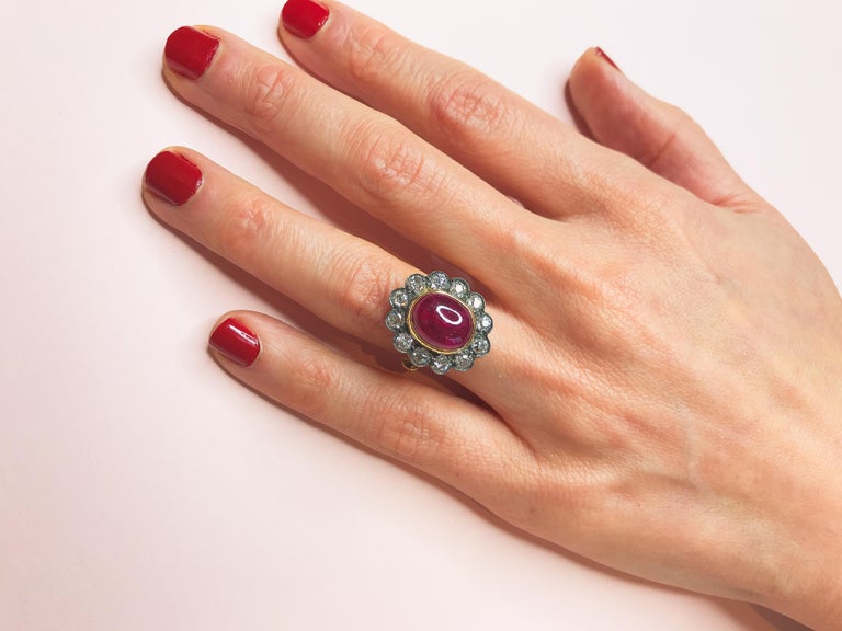 5.51 Carats Ruby Cabochon Ring with a Diamond Halo For Sale at 1stDibs