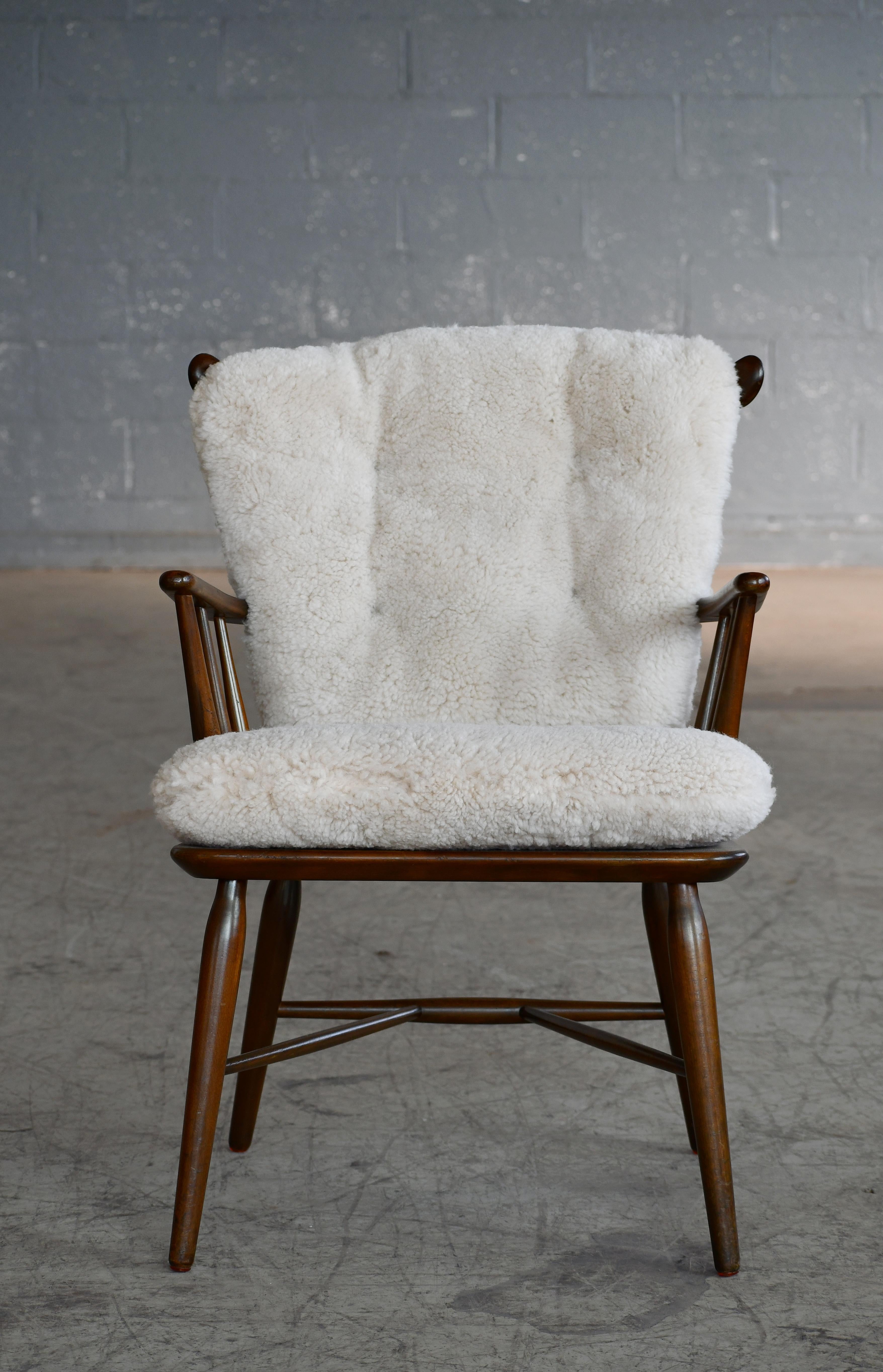 Faarstrup 1950's Low Spindle Back Chair with Shearling Cushions at 1stDibs