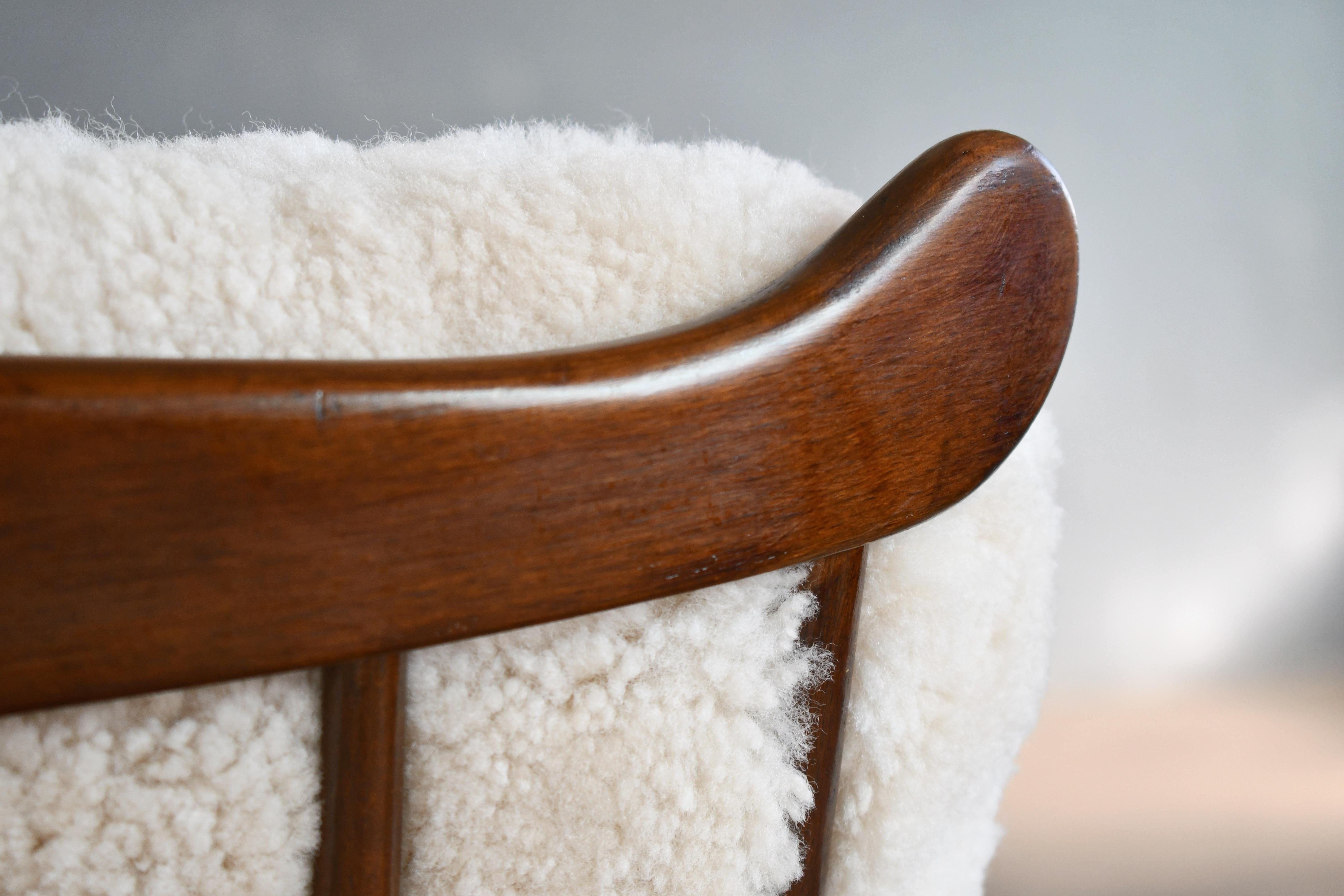 Faarstrup 1950's Low Spindle Back Chair with Shearling Cushions at 1stDibs