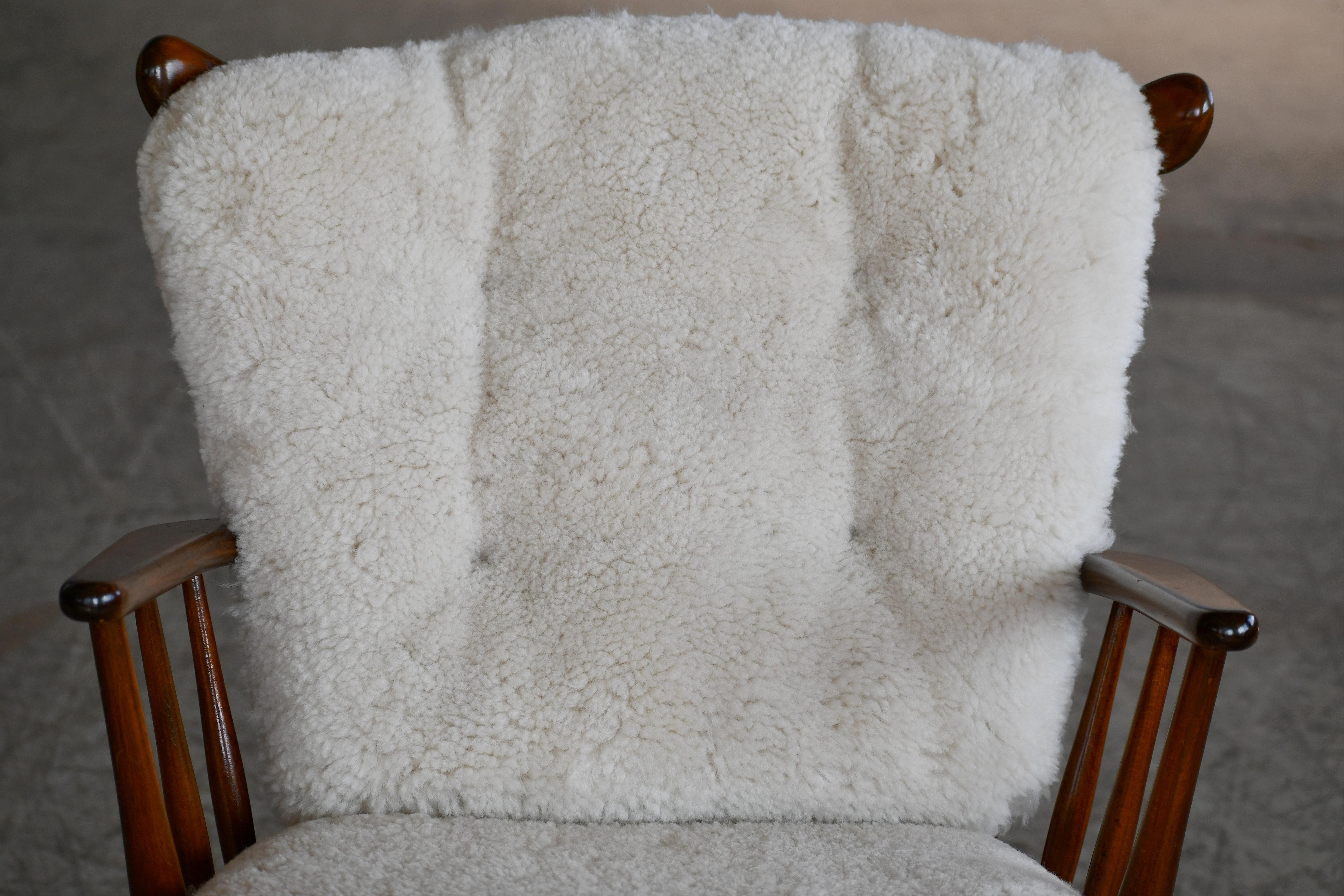 Faarstrup 1950's Low Spindle Back Chair with Shearling Cushions at 1stDibs