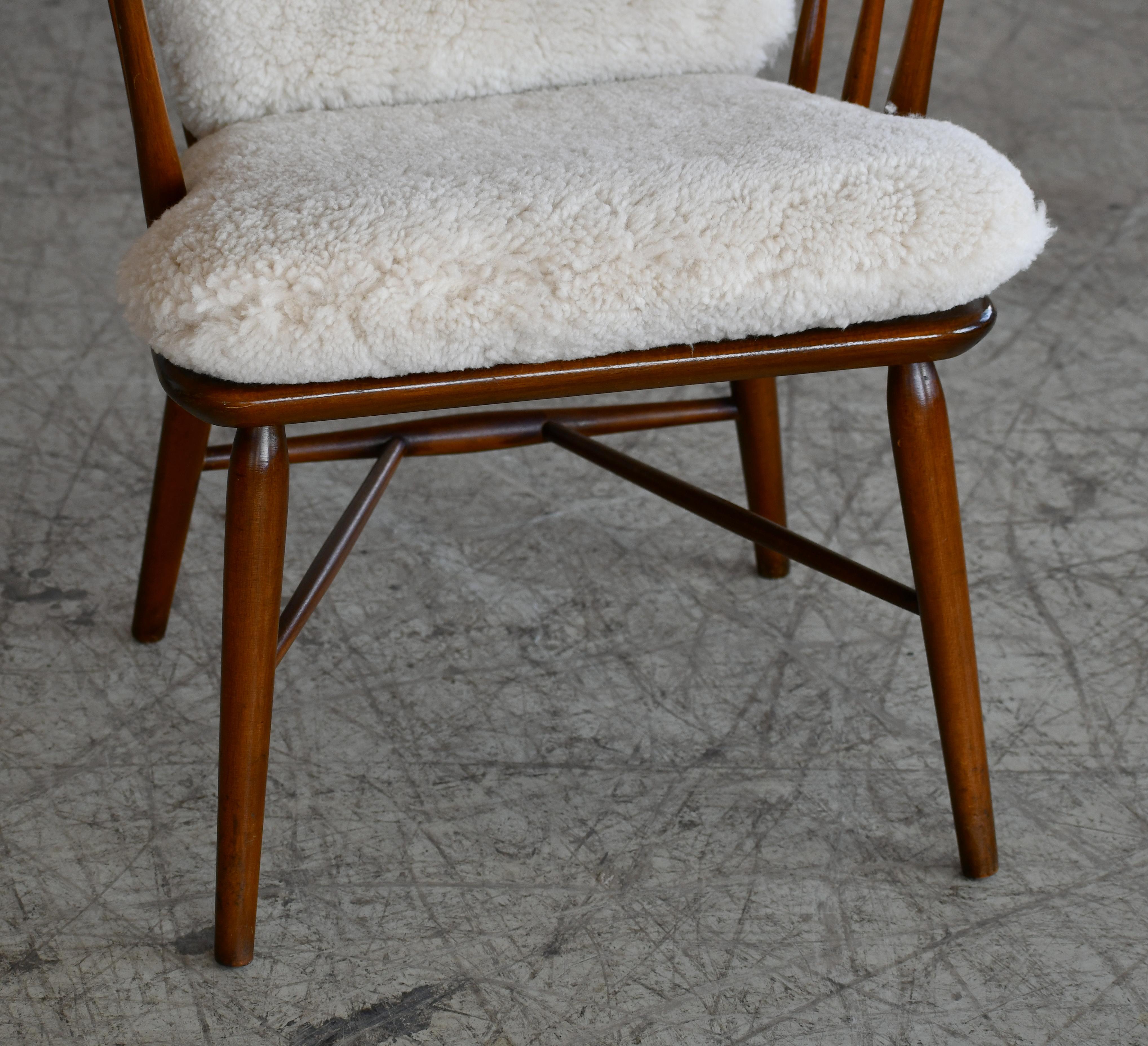 Faarstrup 1950's Low Spindle Back Chair with Shearling Cushions at 1stDibs