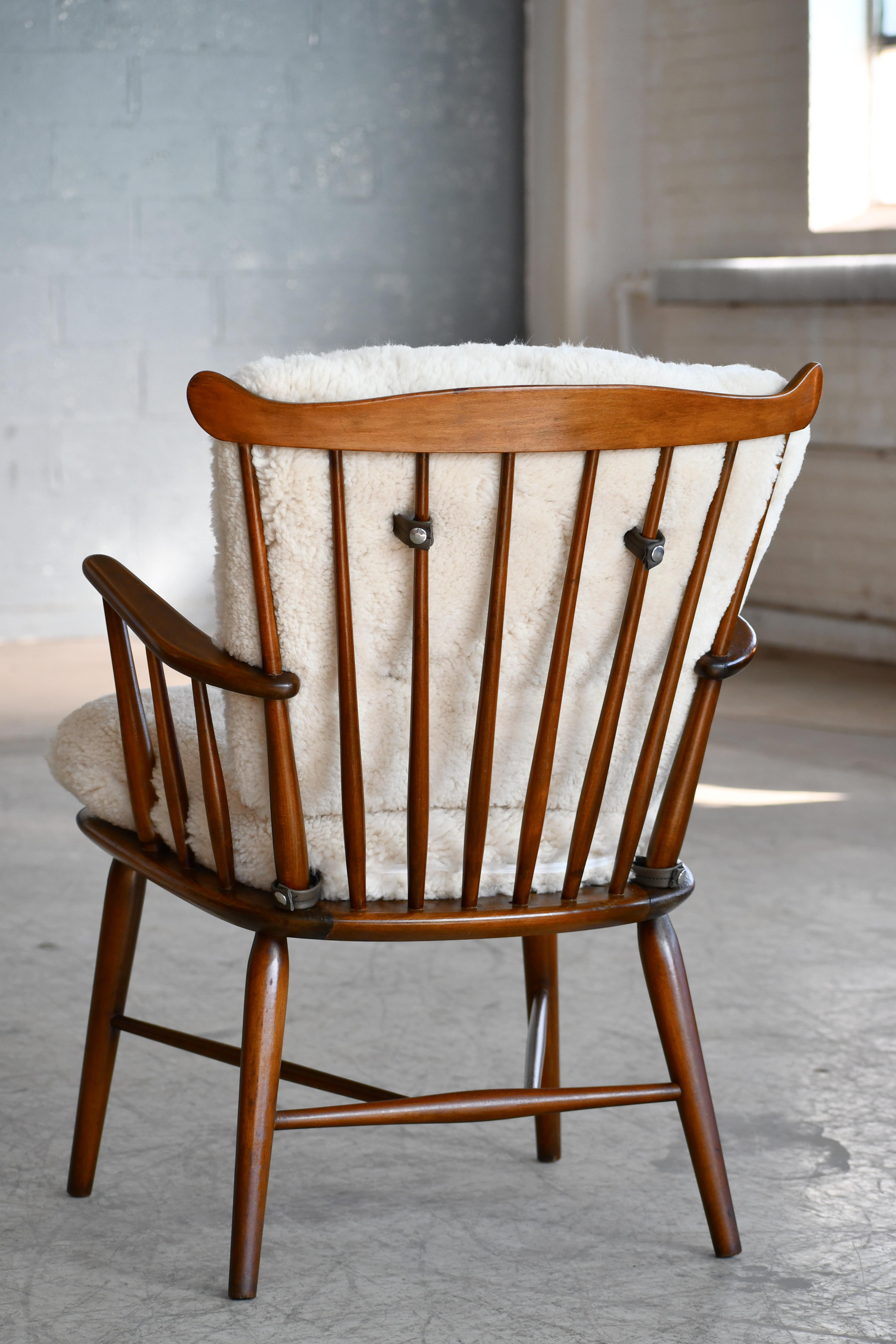 Faarstrup 1950's Low Spindle Back Chair with Shearling Cushions at 1stDibs