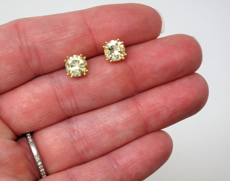Fancy Light Yellow Round Diamond Stud Earrings with White Diamond Halo ...