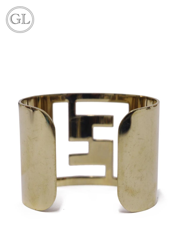 Fendi Gold Cuff Bracelet with Fendi Logo Cut Out For Sale at 1stDibs
