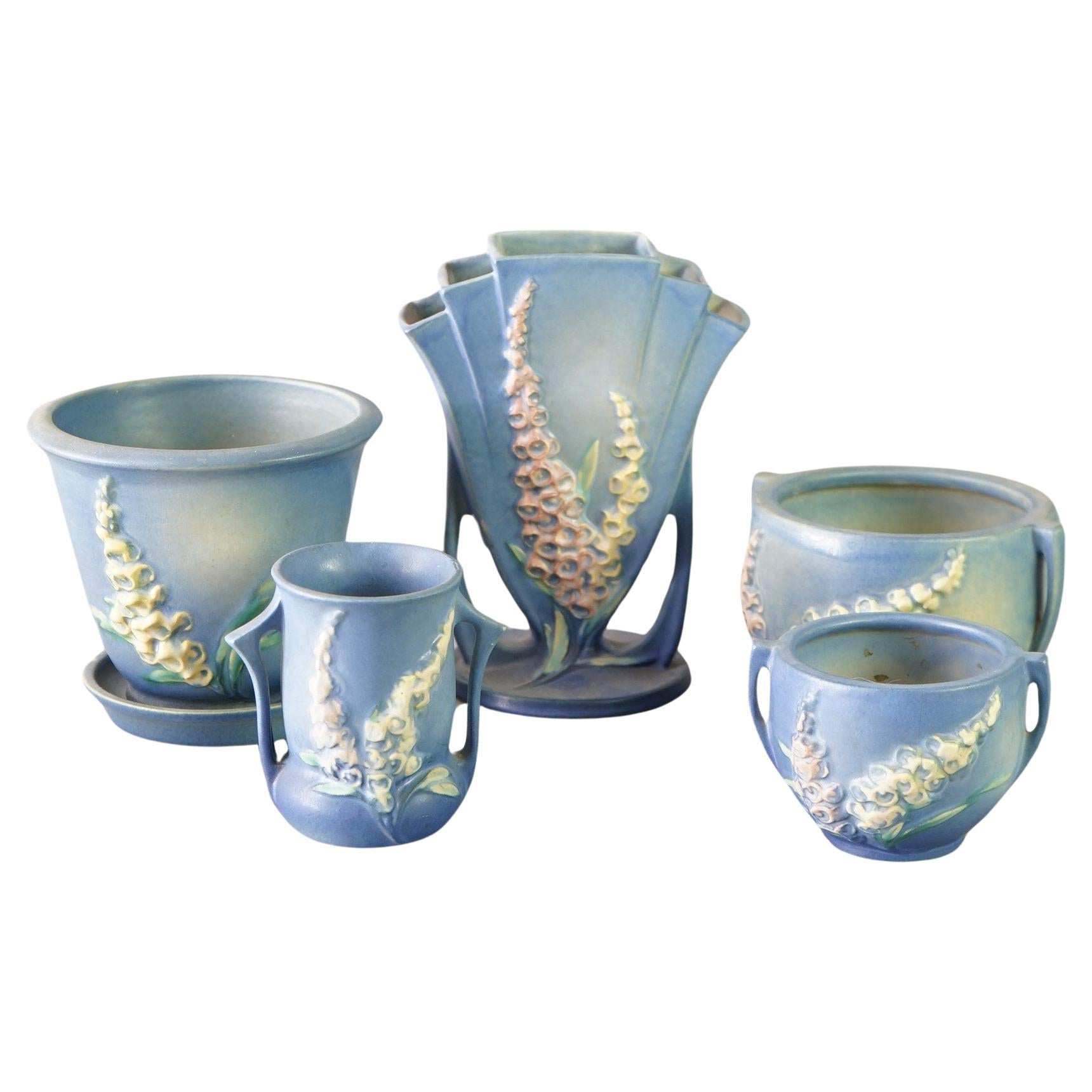 Five Pieces of Blue Roseville Art Pottery with White Rose Pattern Mid ...