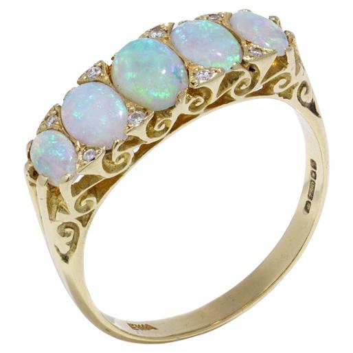 Five Stone Opal ring set in 18kt yellow gold. For Sale at 1stDibs