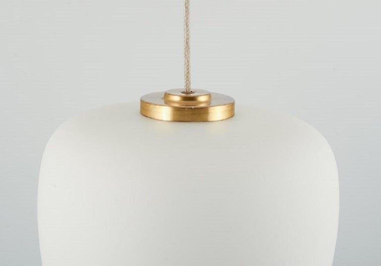 Fog and Mørup pendant in frosted opal glass with brass mounting. Mid ...
