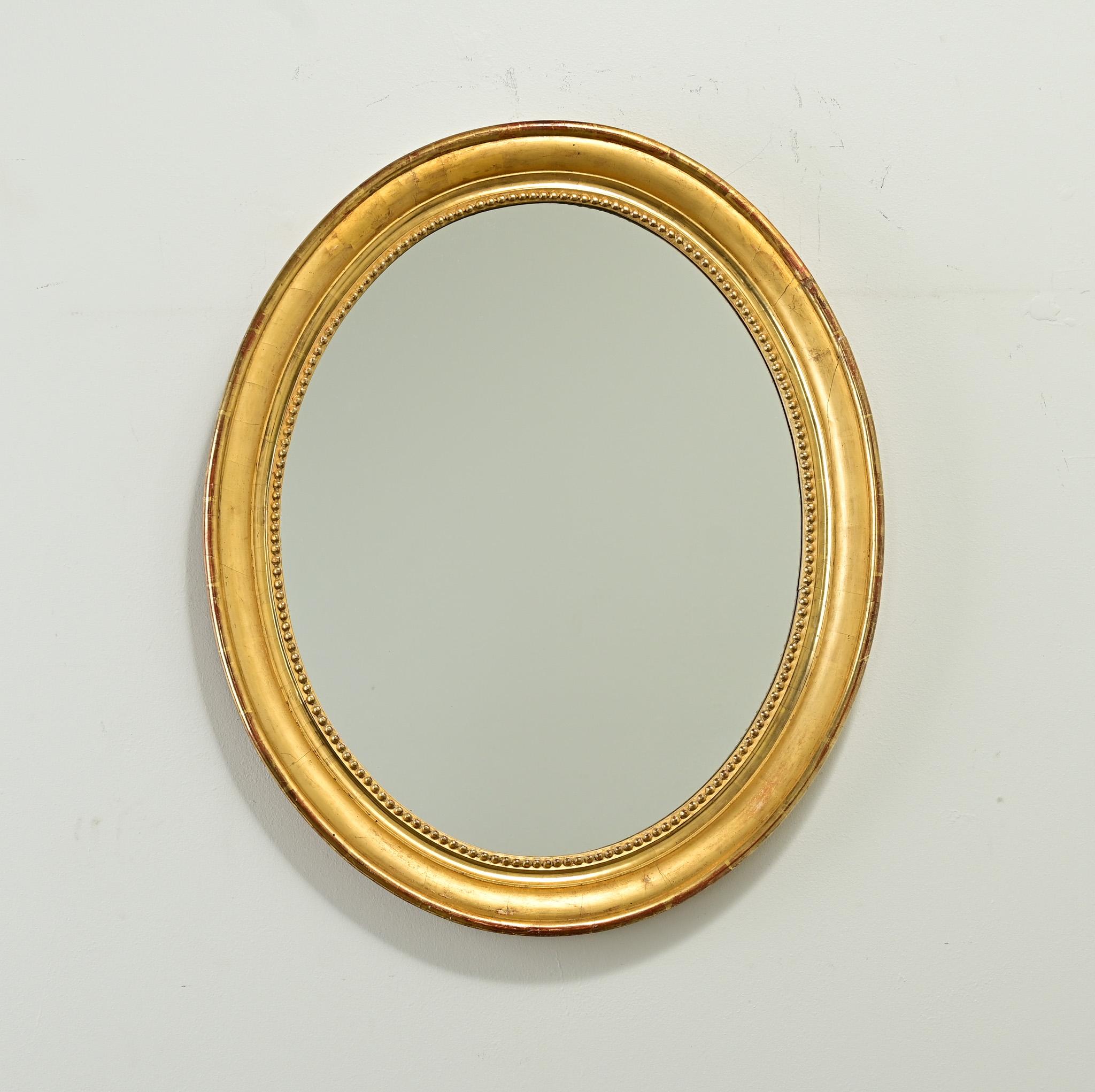 French 19th Century Oval Gold Gilt Mirror at 1stDibs
