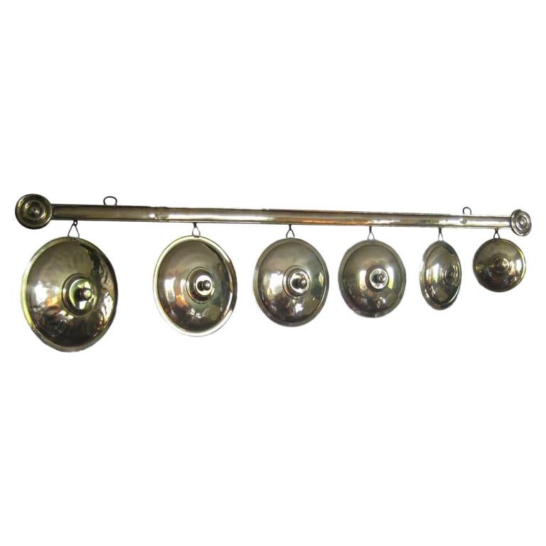 Six Graduated French Pot Lids on Hanger For Sale at 1stDibs