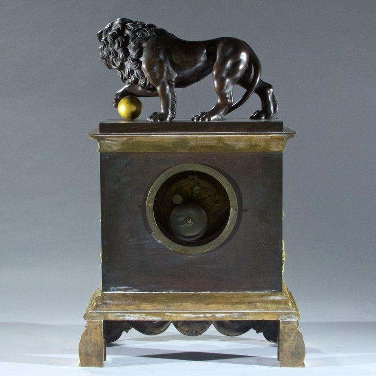 French Empire Mantel Clock Depicting Medici Lions at 1stDibs