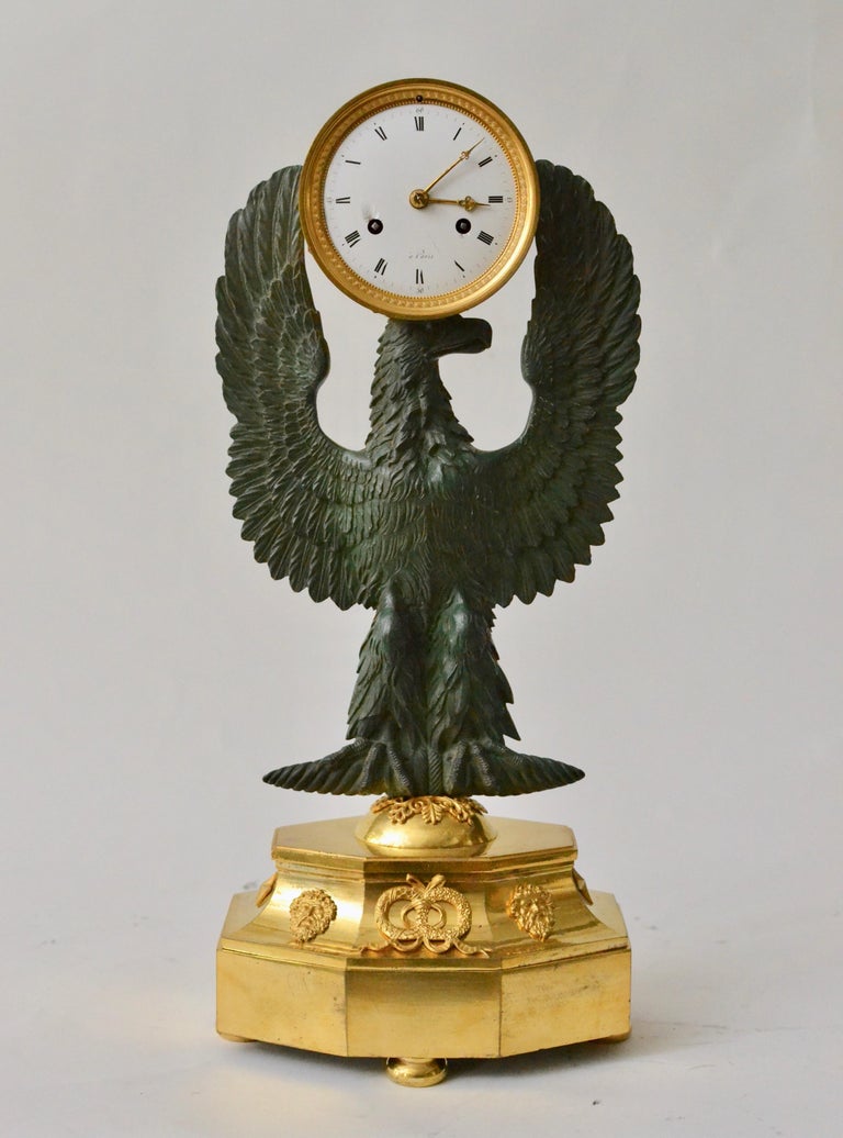 French Gilt and Patinated Empire Bronze Clock at 1stDibs