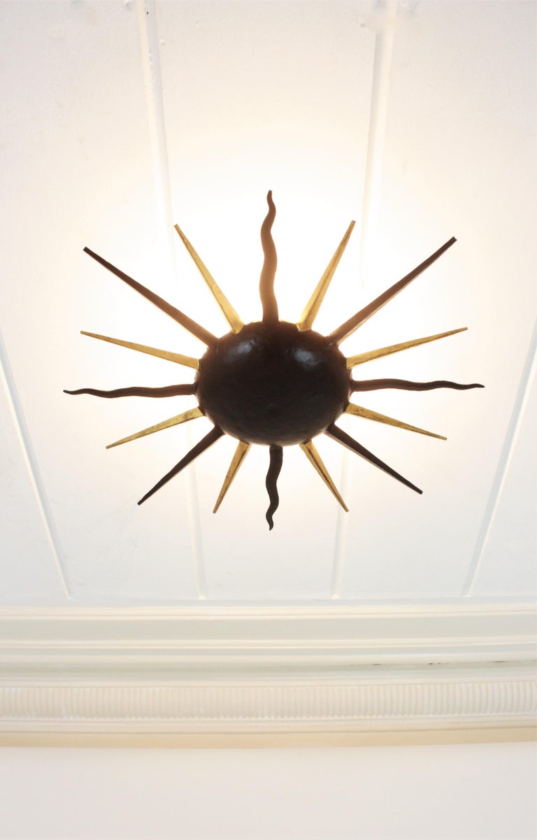 French Sunburst Light Fixture in Black and Gilt Iron, Gilbert Poillerat ...