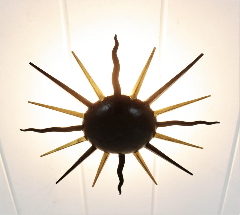 French Sunburst Light Fixture in Black and Gilt Iron, Gilbert Poillerat ...