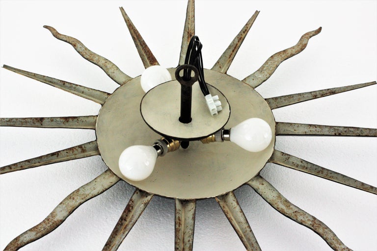 French Sunburst Light Fixture in Black and Gilt Iron, Gilbert Poillerat ...