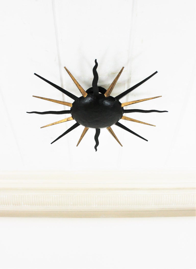 French Sunburst Light Fixture in Black and Gilt Iron, Gilbert Poillerat ...