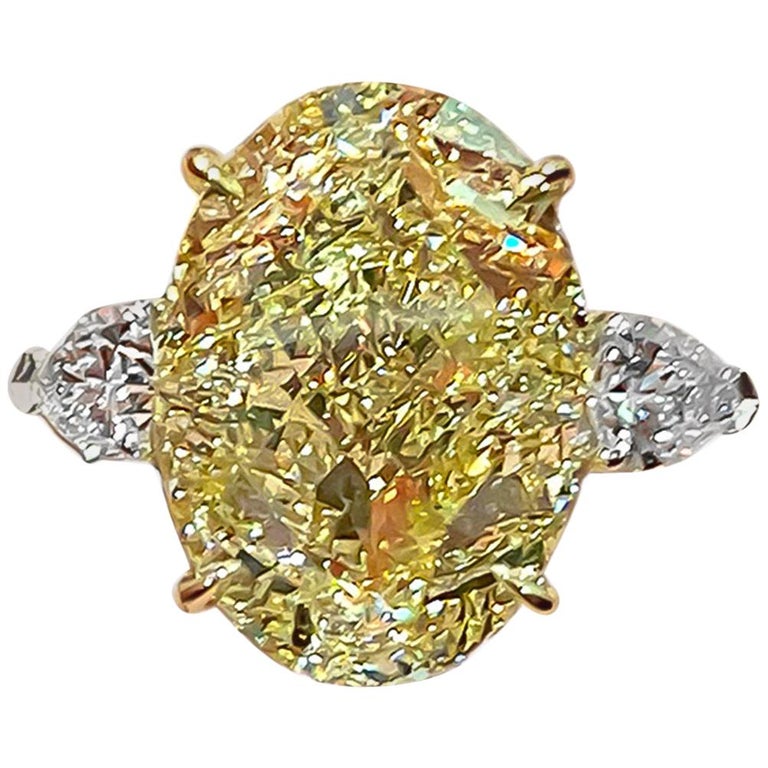 GIA Certified 20.02 Carat Oval Fancy Intense Yellow Diamond Ring For Sale at 1stDibs