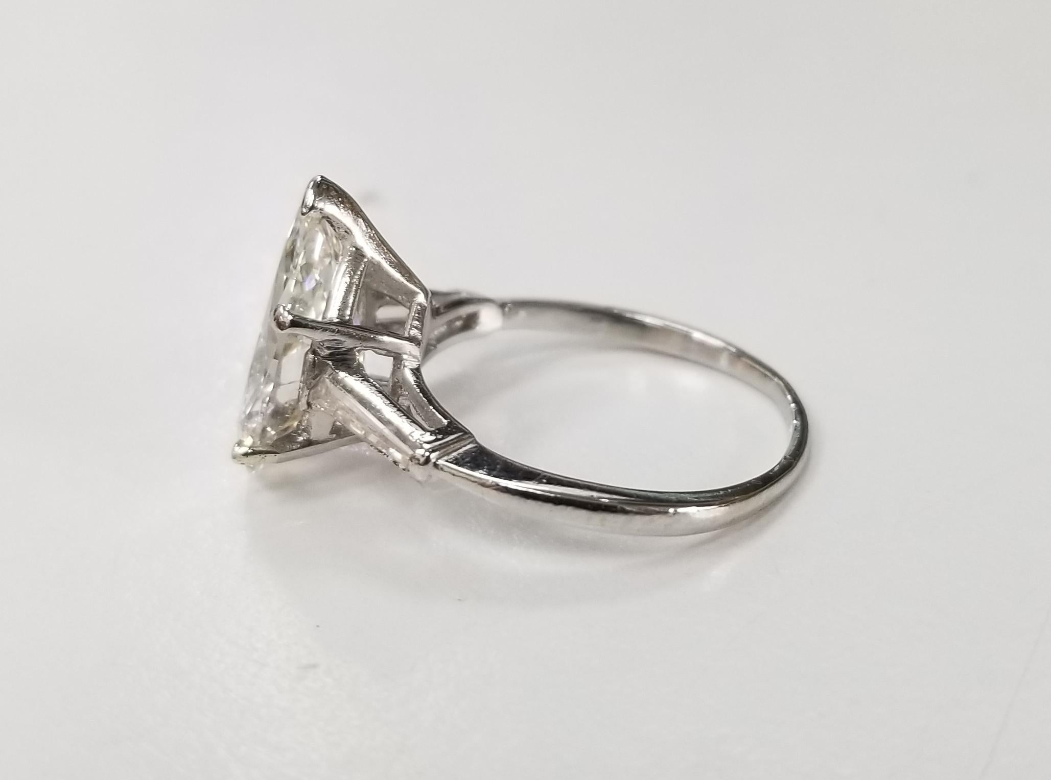 GIA Certified 3.79cts. Pear Shape Diamond Set in Platinum w/ 2 Tapper ...