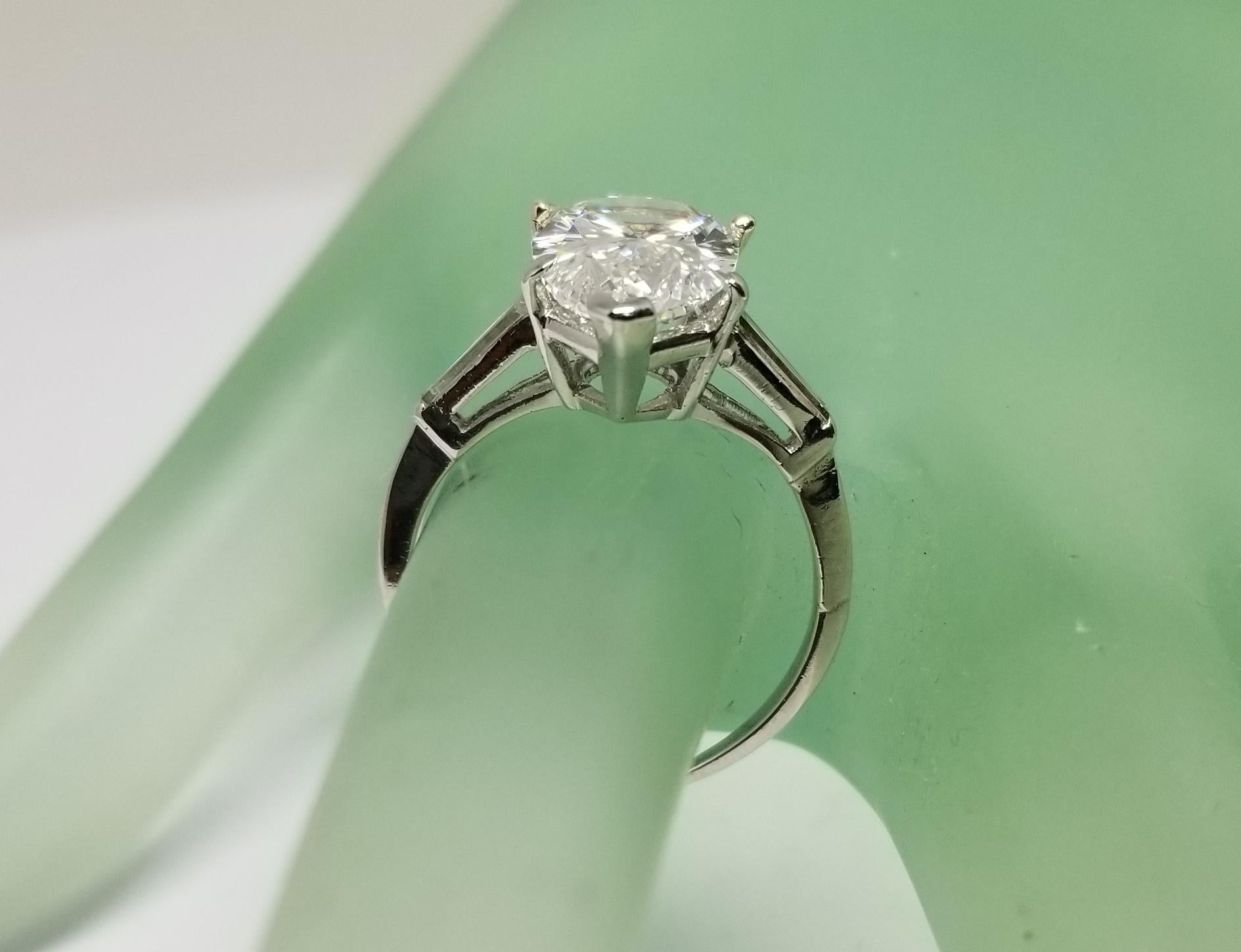 GIA Certified 3.79cts. Pear Shape Diamond Set in Platinum w/ 2 Tapper ...