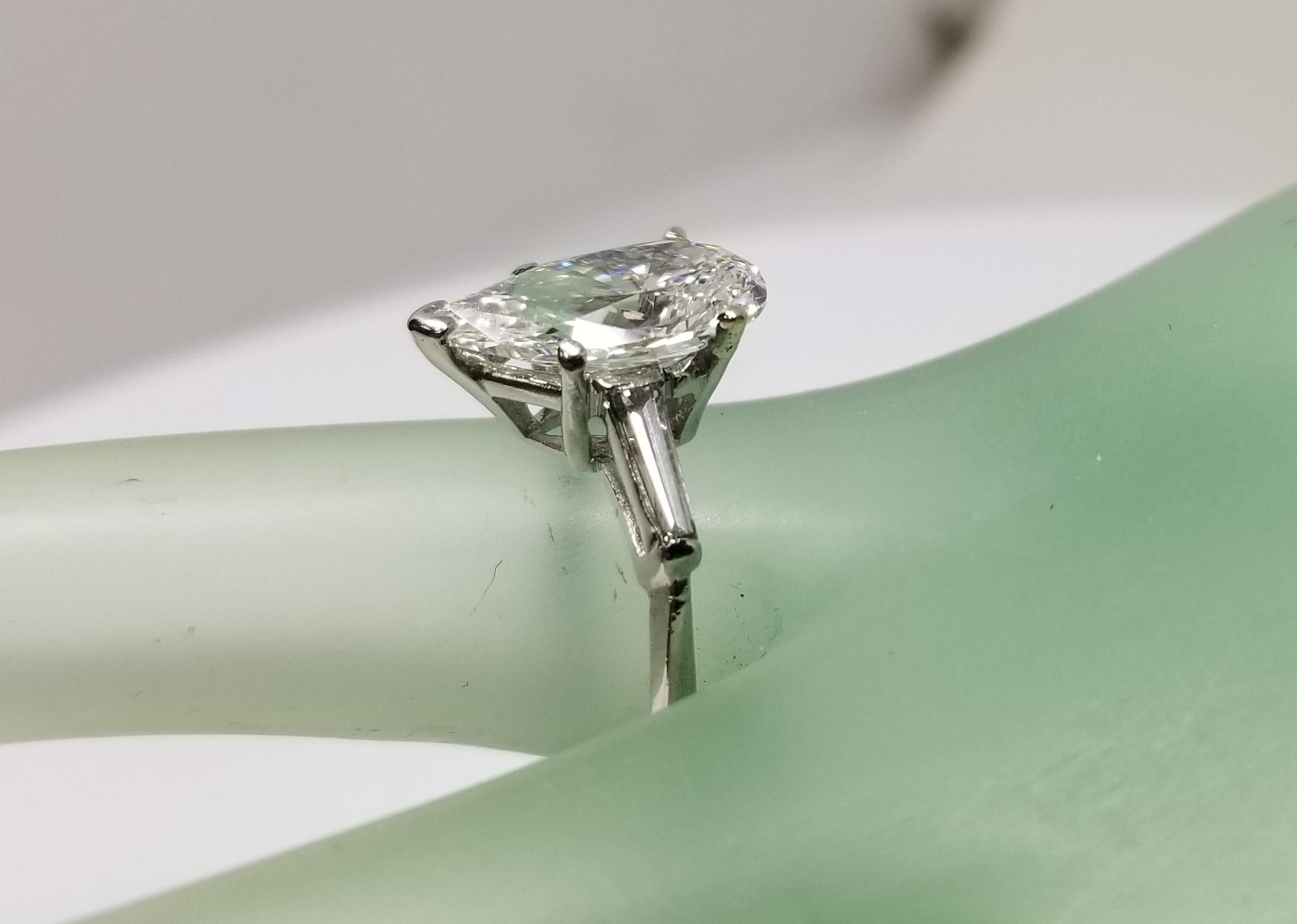 GIA Certified 3.79cts. Pear Shape Diamond Set in Platinum w/ 2 Tapper ...