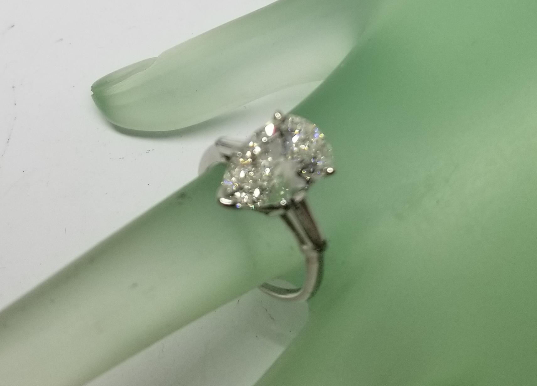 GIA Certified 3.79cts. Pear Shape Diamond Set in Platinum w/ 2 Tapper ...