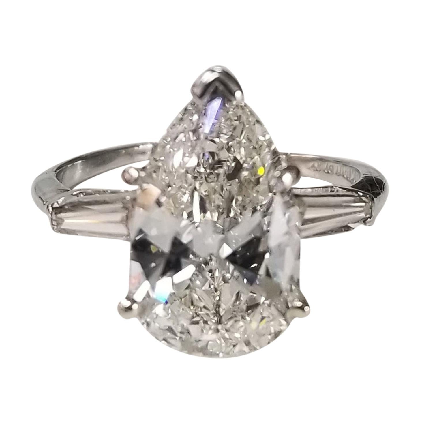 GIA Certified 3.79cts. Pear Shape Diamond Set in Platinum w/ 2 Tapper ...