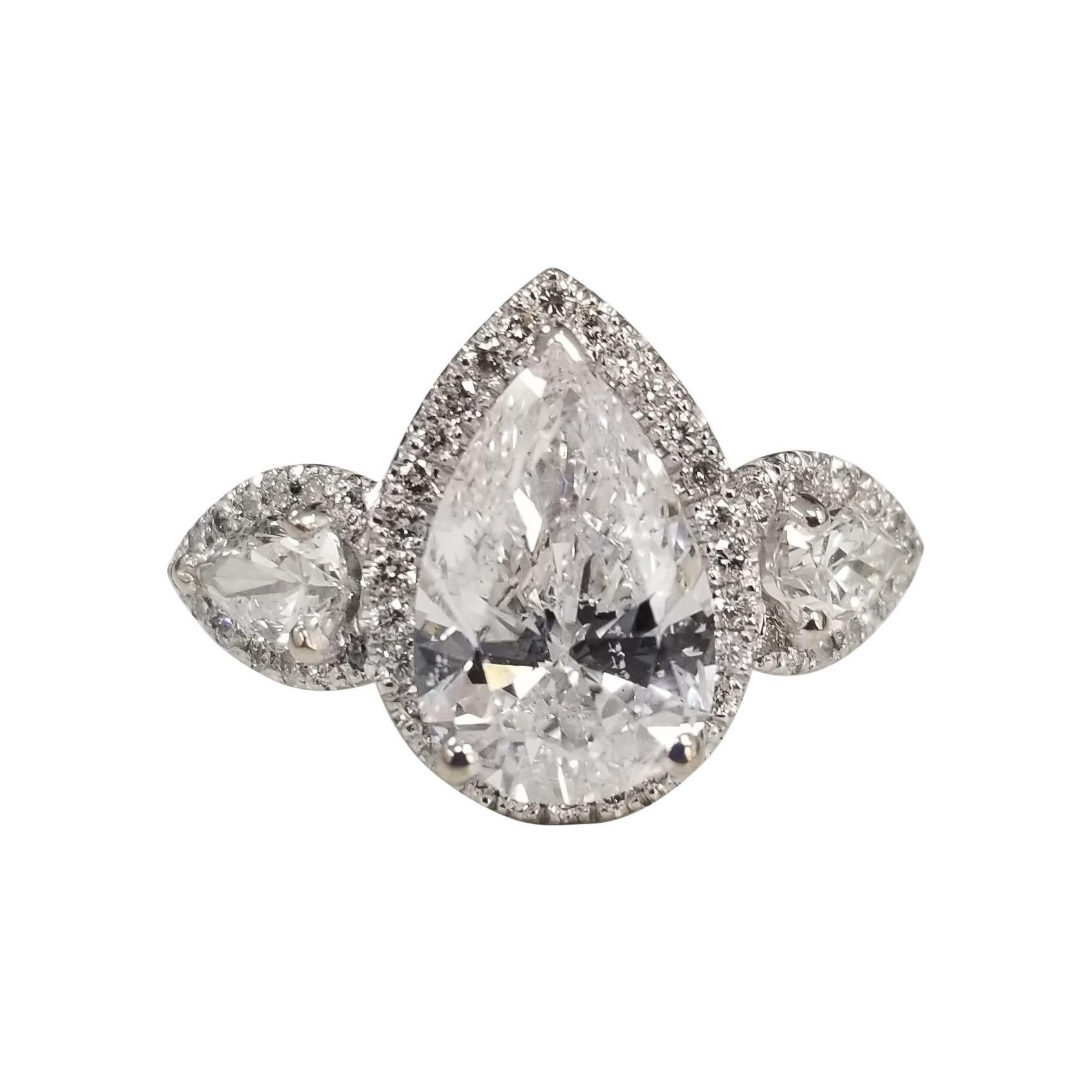 GIA Certified 3.79cts. Pear Shape Diamond Set in Platinum w/ 2 Tapper ...