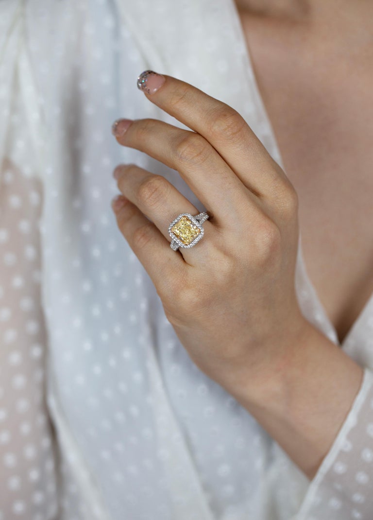GIA Certified 4.51 Carats Radiant Cut Fancy Yellow Diamond Halo Engagement Ring For Sale at 1stDibs