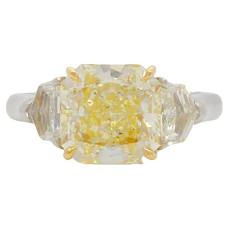 GIA Fancy Yellow Diamond Radiant and White Diamond Three Stone Ring For ...