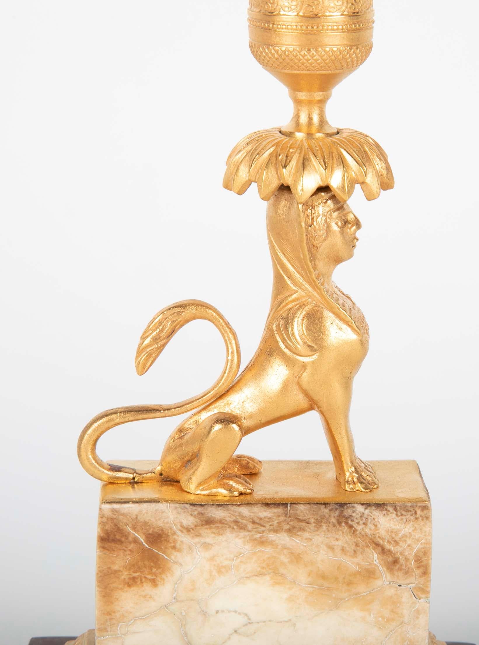 Gilt Sphinx Themed Candlestick on a Stepped Marble Base For Sale at 1stDibs