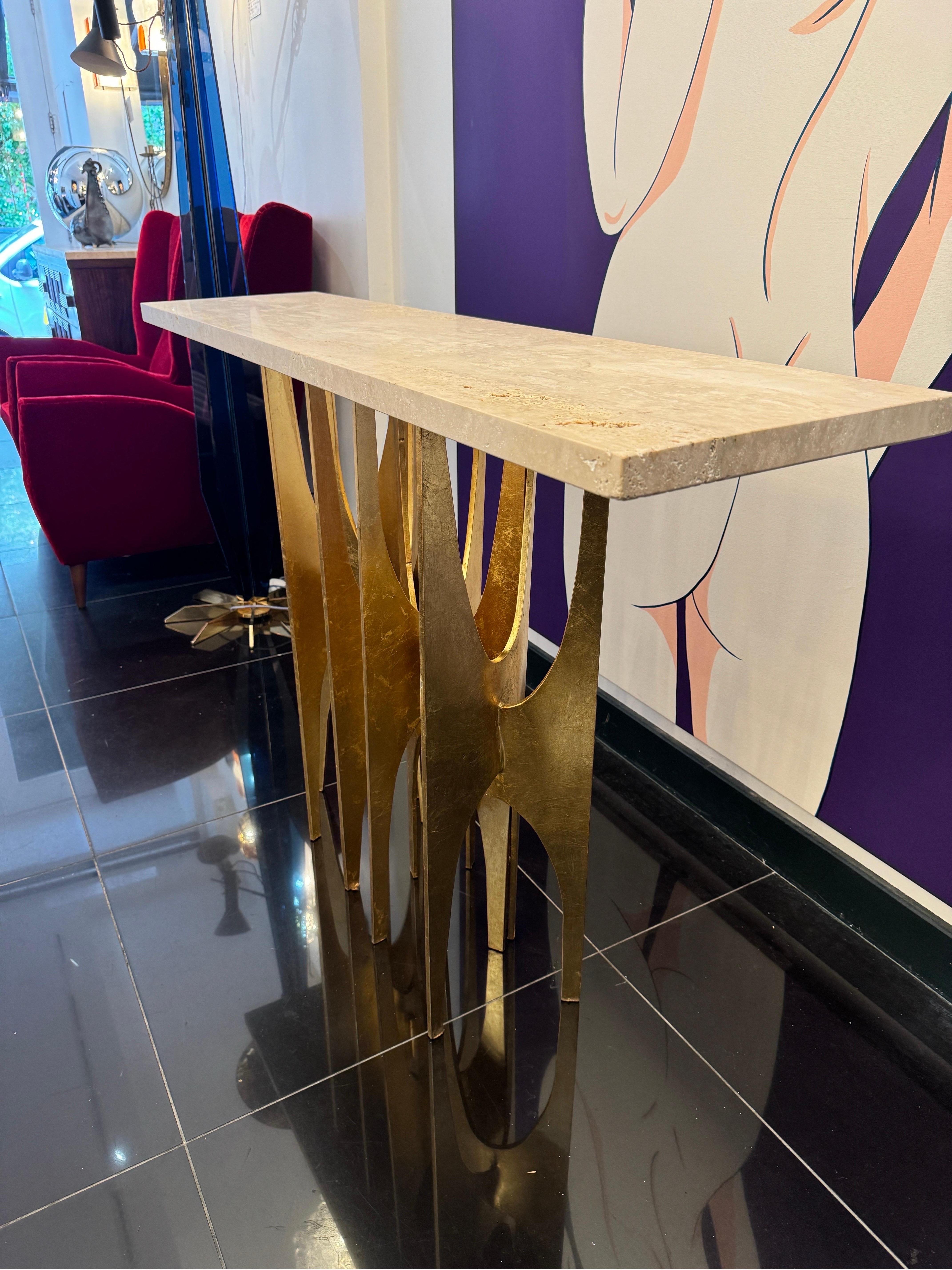 Giovanni Banci sculptural gilt iron, travertine console table . For ...