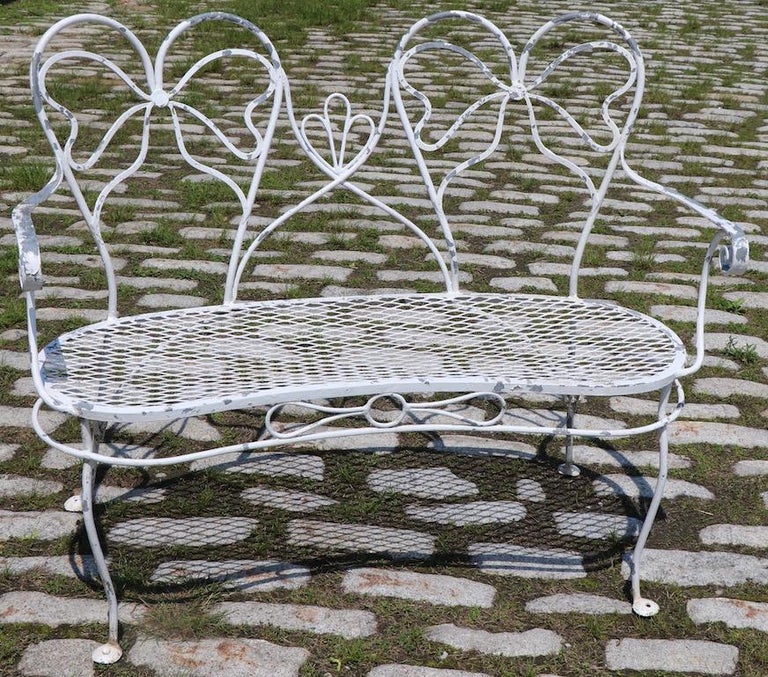 Glamorous Wrought Iron Garden Bench with Bow Tie Back at 1stDibs