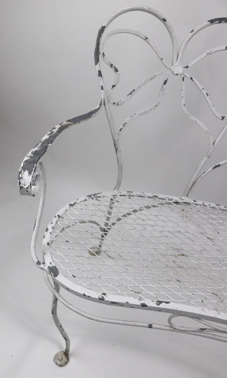 Glamorous Wrought Iron Garden Bench with Bow Tie Back at 1stDibs