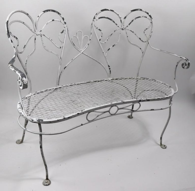 Glamorous Wrought Iron Garden Bench with Bow Tie Back at 1stDibs