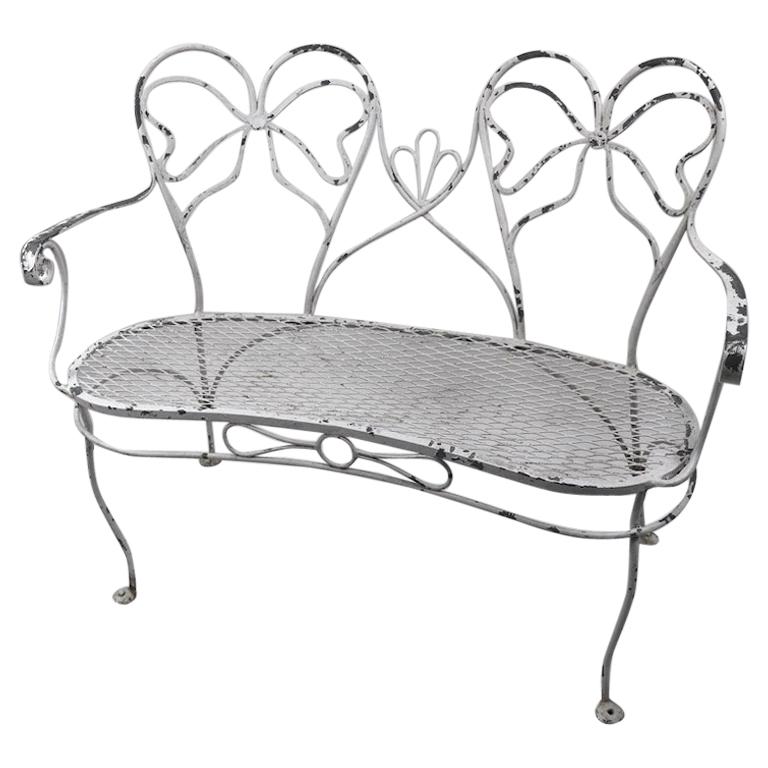 Glamorous Wrought Iron Garden Bench with Bow Tie Back at 1stDibs